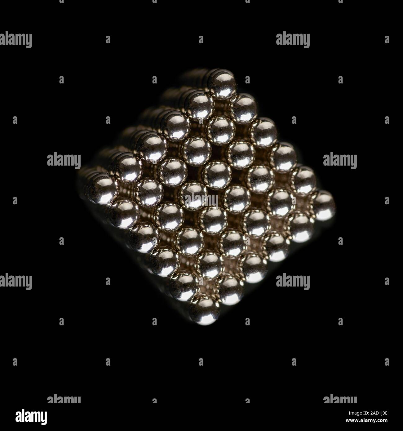 Super magnets. A cube made from 216 spherical neodymium super magnets ...