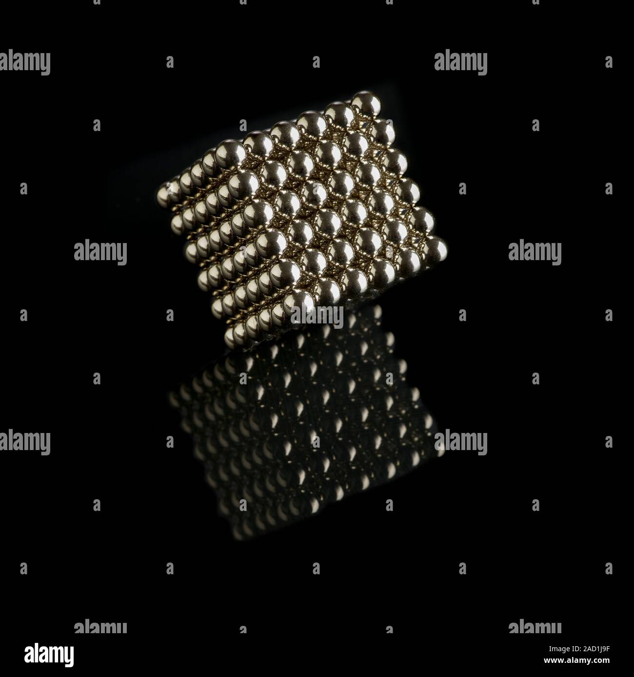 Super magnets. A cube made from 216 spherical neodymium super magnets ...