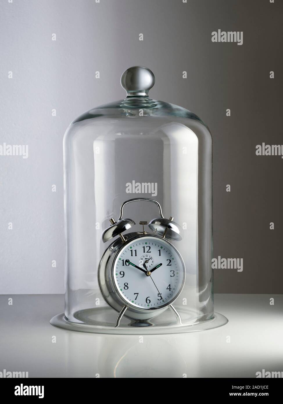 Alarm clock inside a bell jar. This illustrates an experiment to show ...