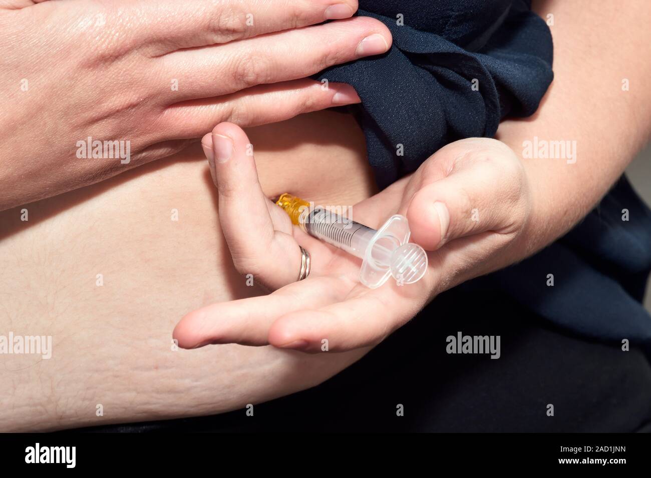 Gastric band adjustment injection. Patient adjusting their gastric band ...