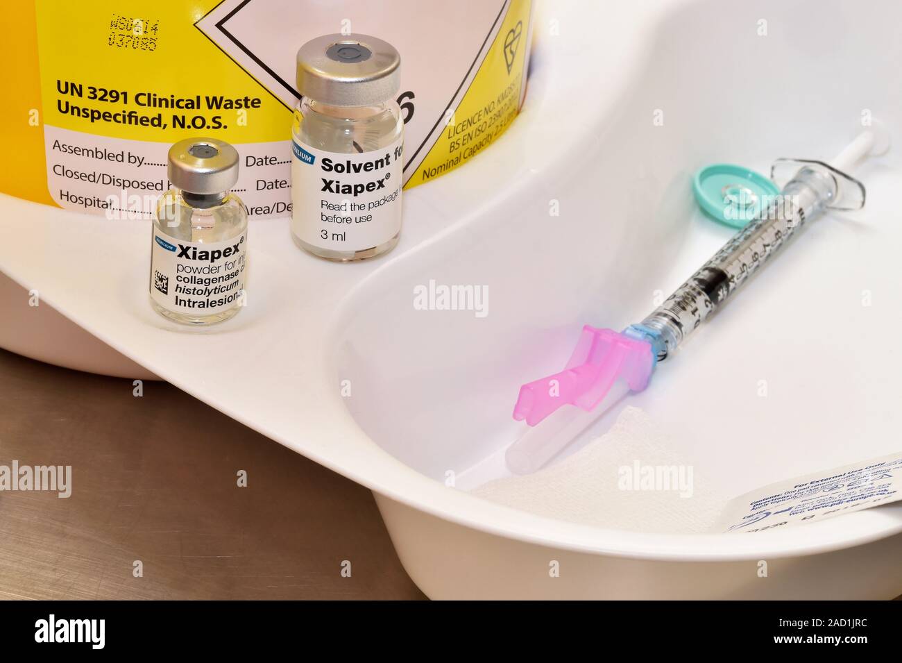 Dupuytren's contracture treatment. Syringe and two vials (powder and ...