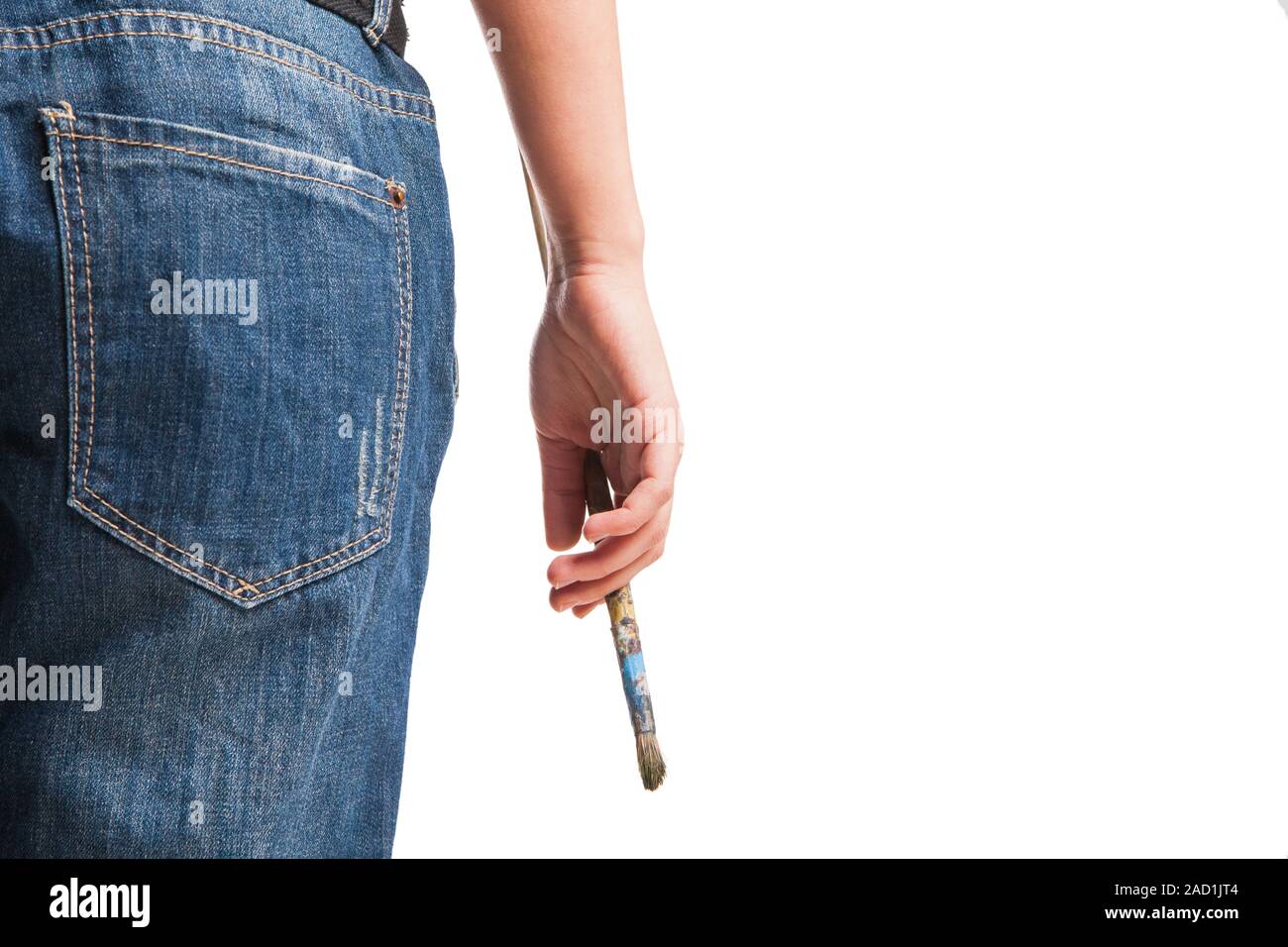Young smiling woman painter with paintbrush standing Stock Photo - Alamy
