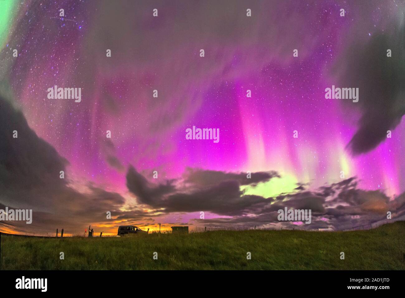 Aurora borealis in the night sky. The aurora borealis is a coloured ...