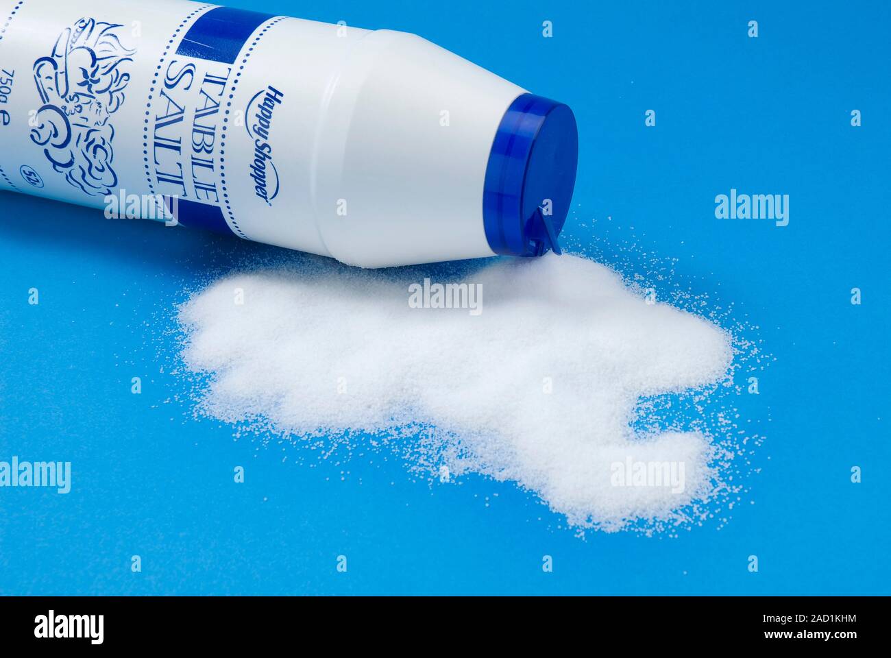 Table salt. Tub of natural table salt (sodium chloride) for cooking ...