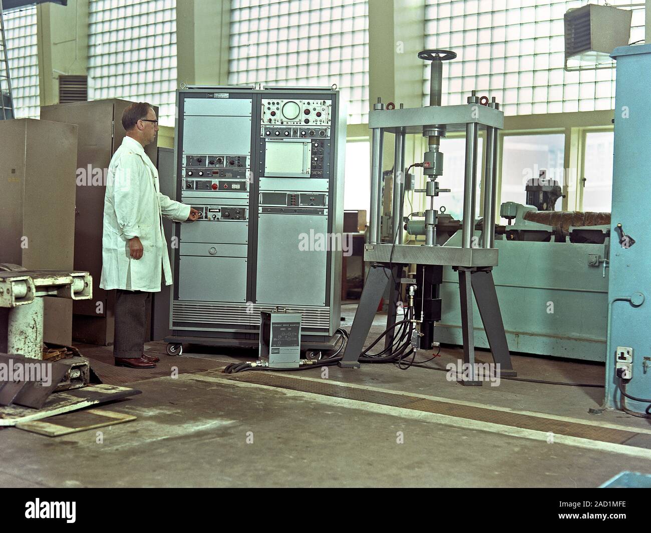 Engineering test laboratory. Researcher carrying out engineering tests ...