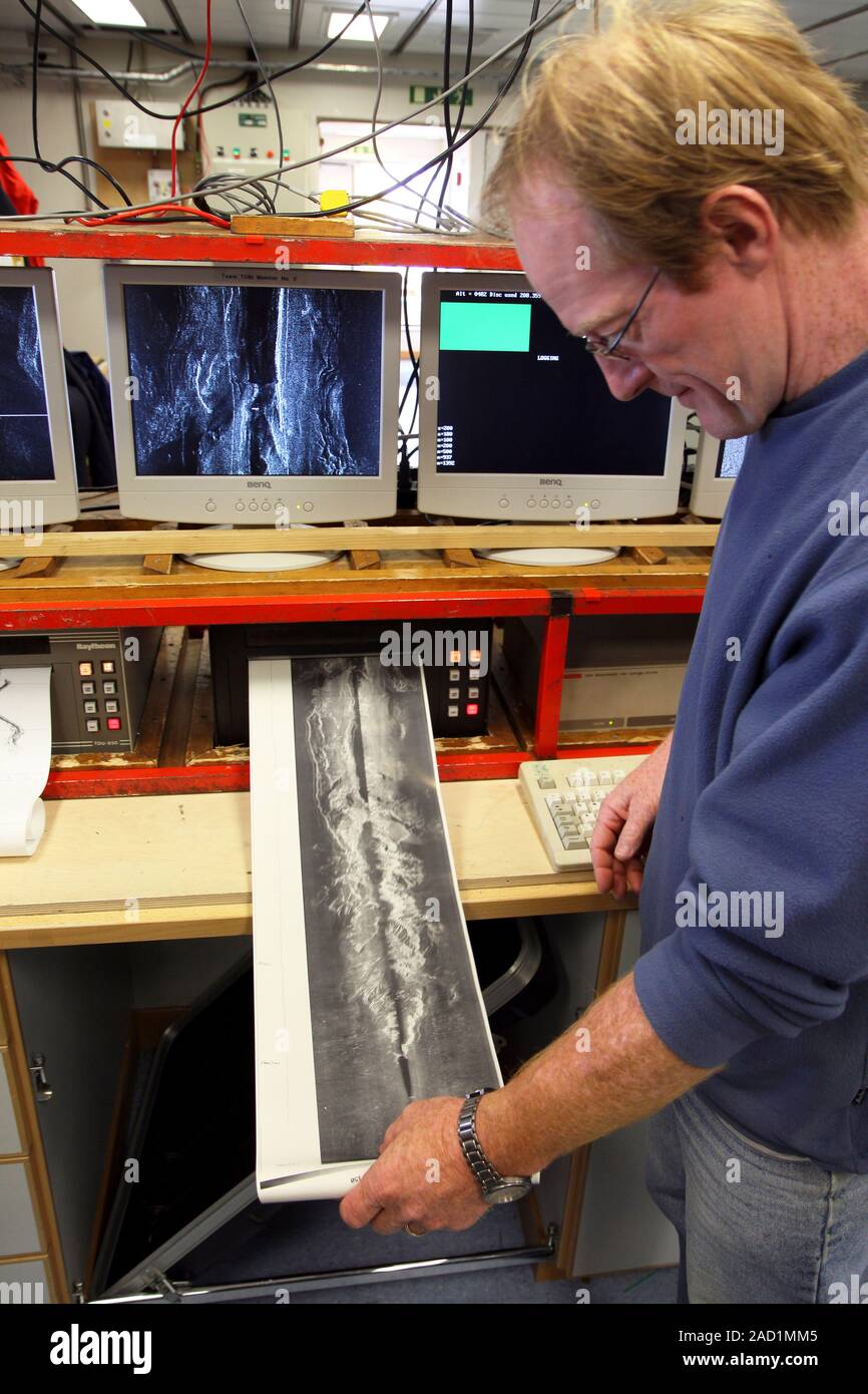 Marine geologist studying a seafloor map produced by the TOBI (Towed ...