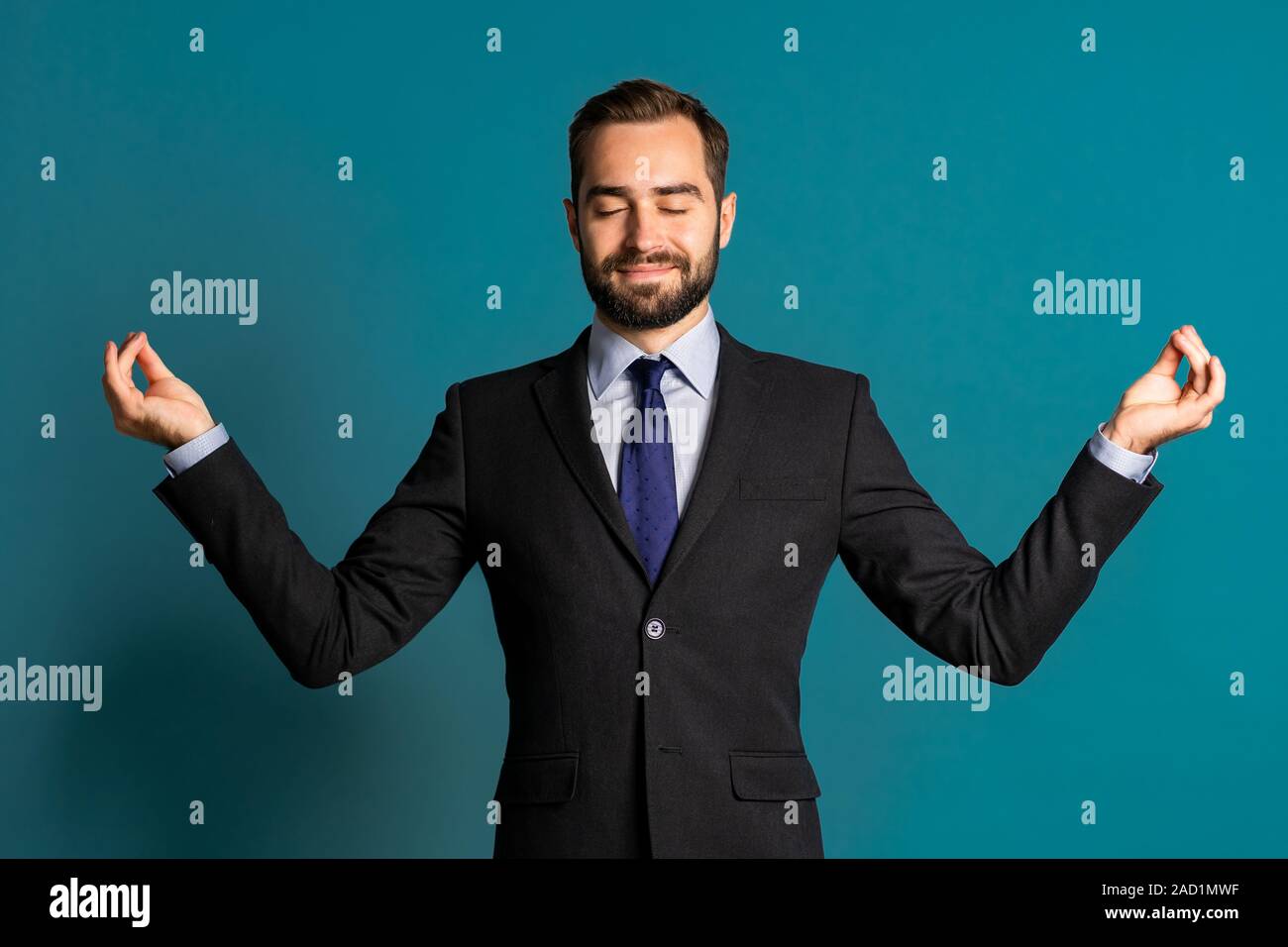 Calm businessman in campaign suit relaxing, meditating. Handsome ...