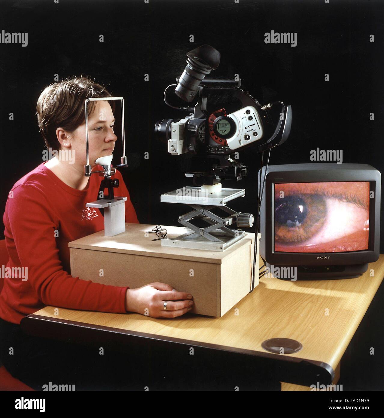 Solvent exposure test facility. Test subject having their eyes examined ...