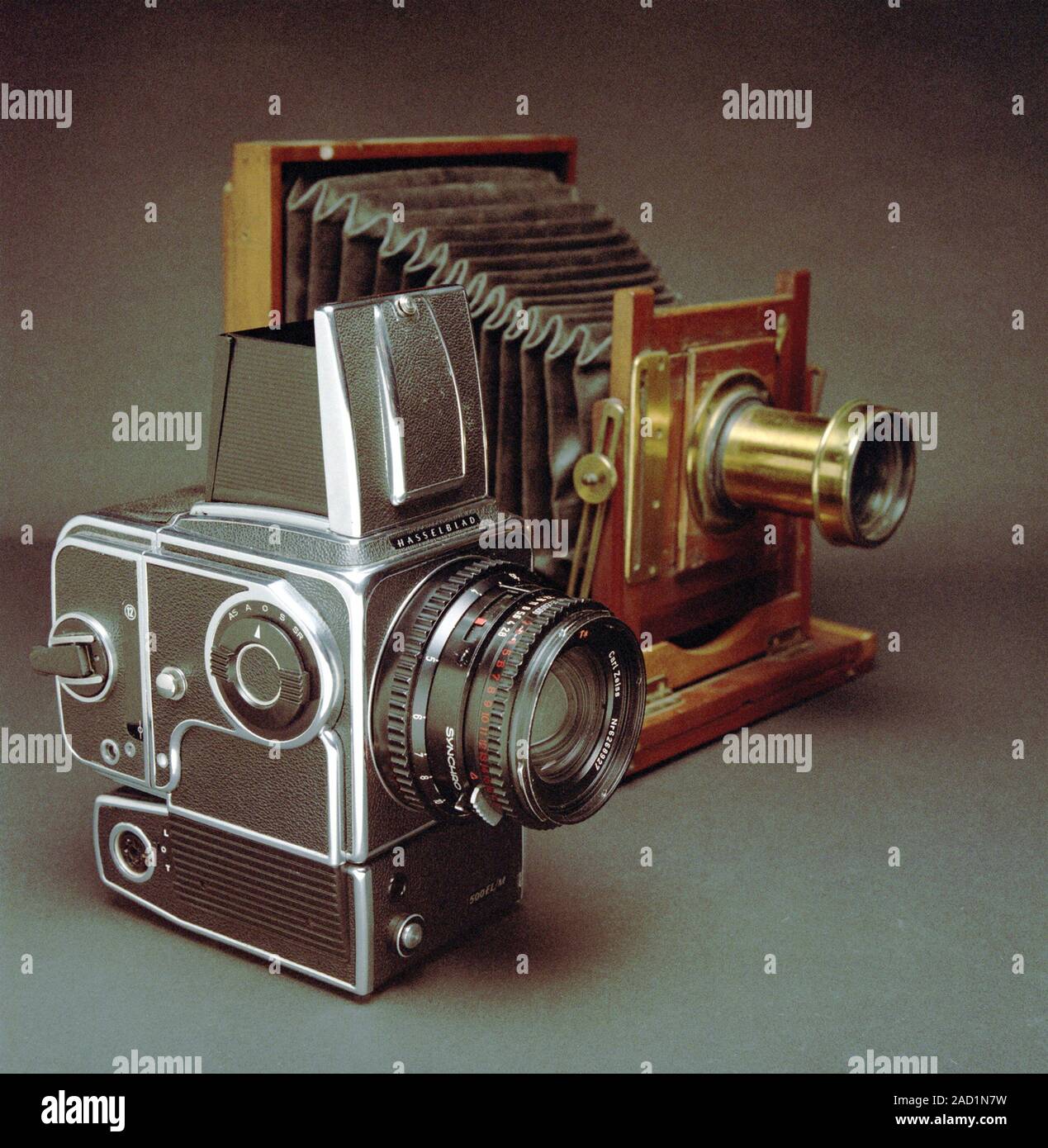 Cameras, 1970s and 19th century. At left is a Hasselblad 500 EL/M ...