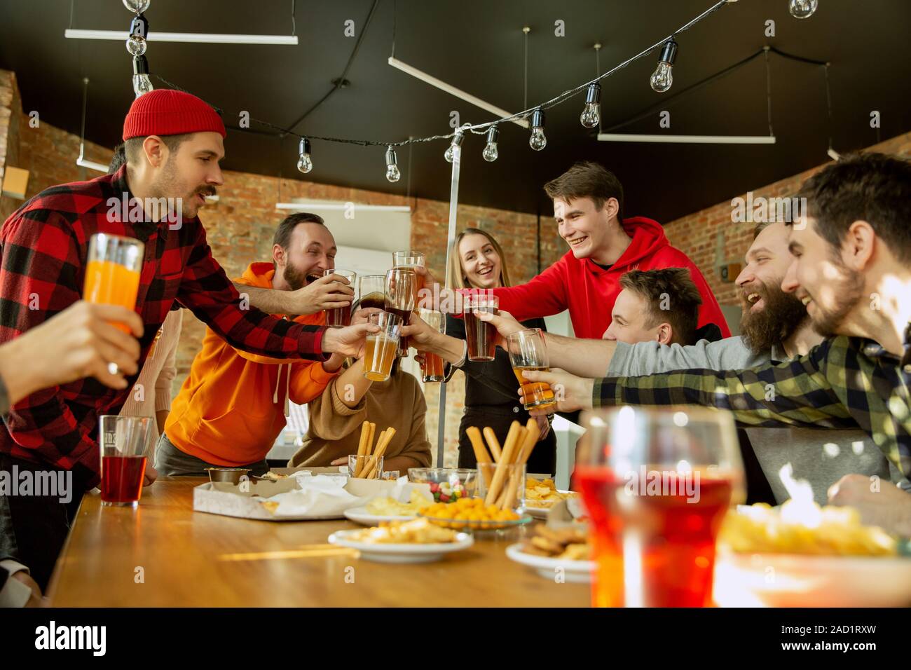 Happy co-workers celebrating while company party and corporate event ...