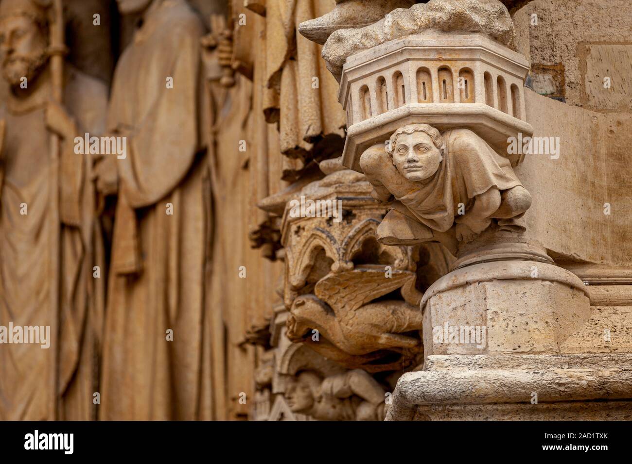Detail of stone carving in the arch entrance to the Cathedral Notre ...