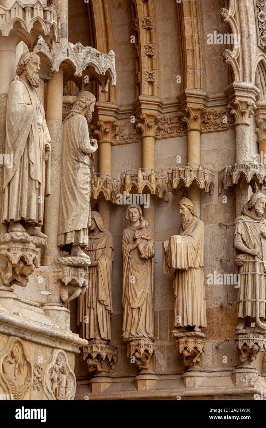 The carved stone arch at the entrance to the Cathedral Notre Dame d ...