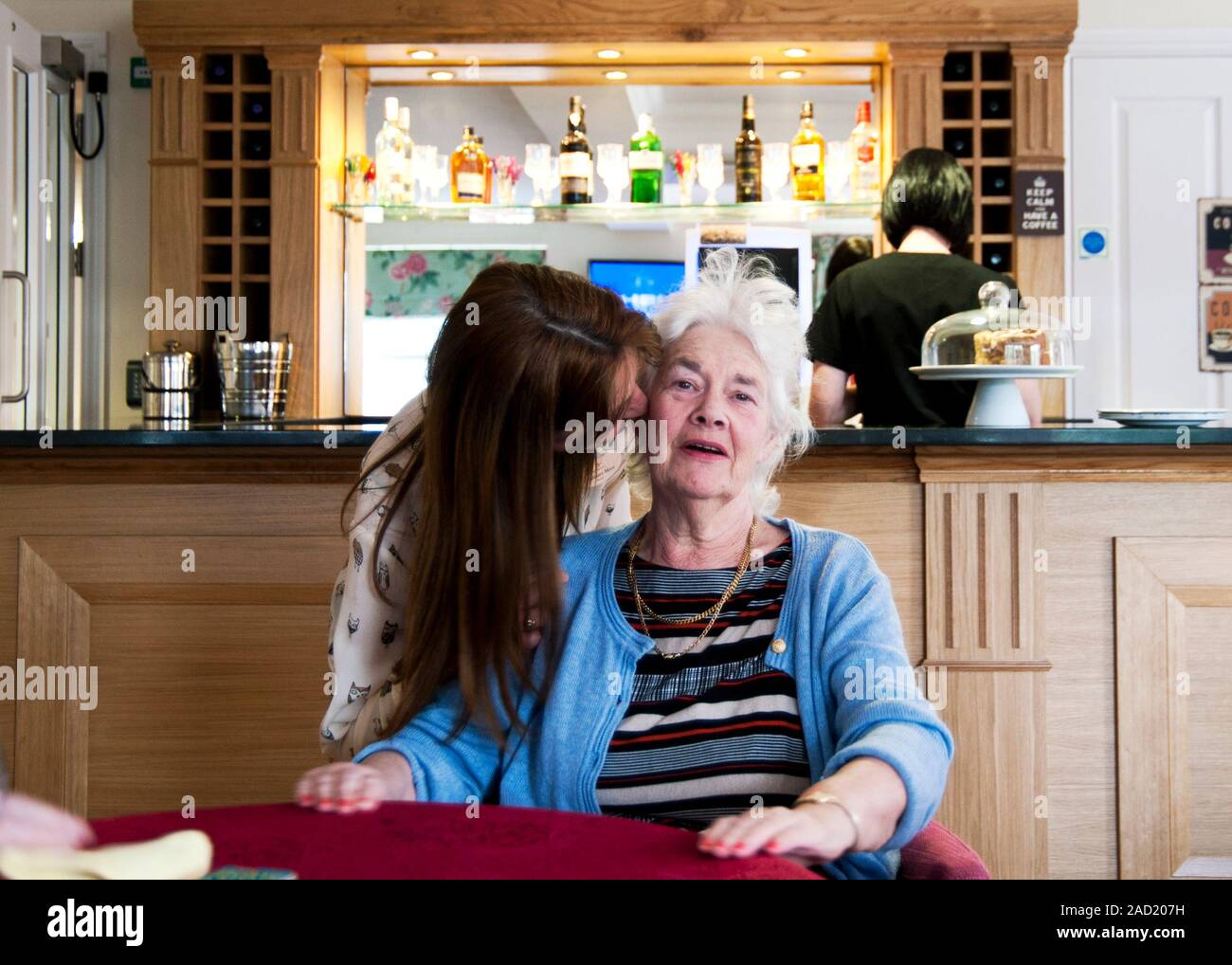 Care home. A staff member with an elderly resident at a care home Stock ...