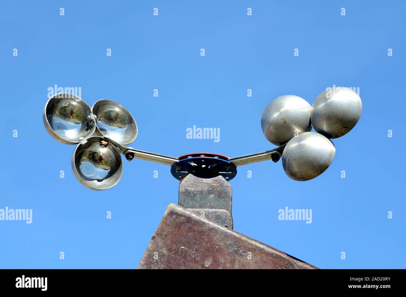 Cup anemometer on a roof. Anemometers are used to measure wind speed ...