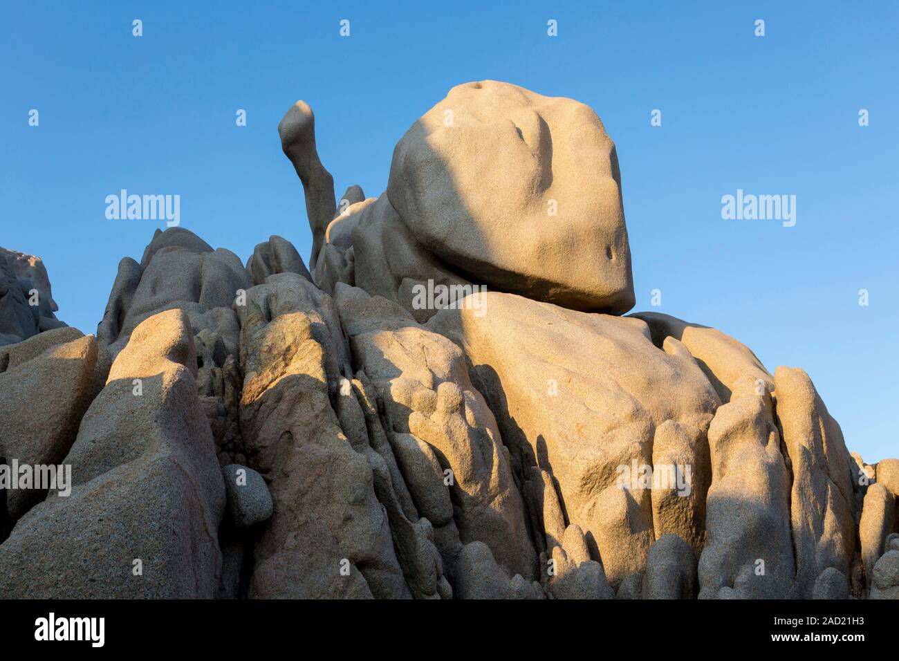Weathering of granitic bedrock favours the formation of rounded shapes ...