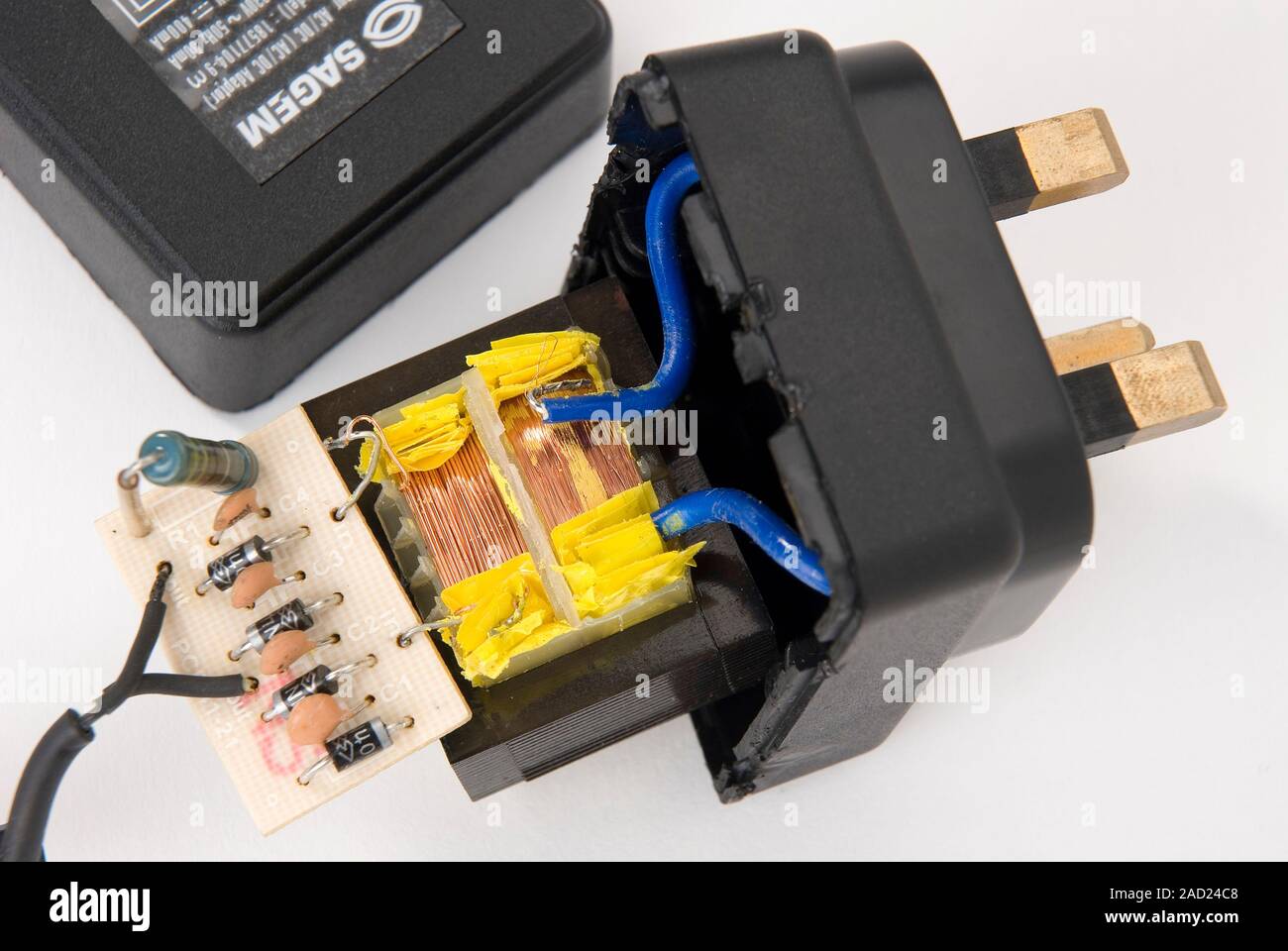 Electrical transformer in a plug. This is a step-down transformer ...