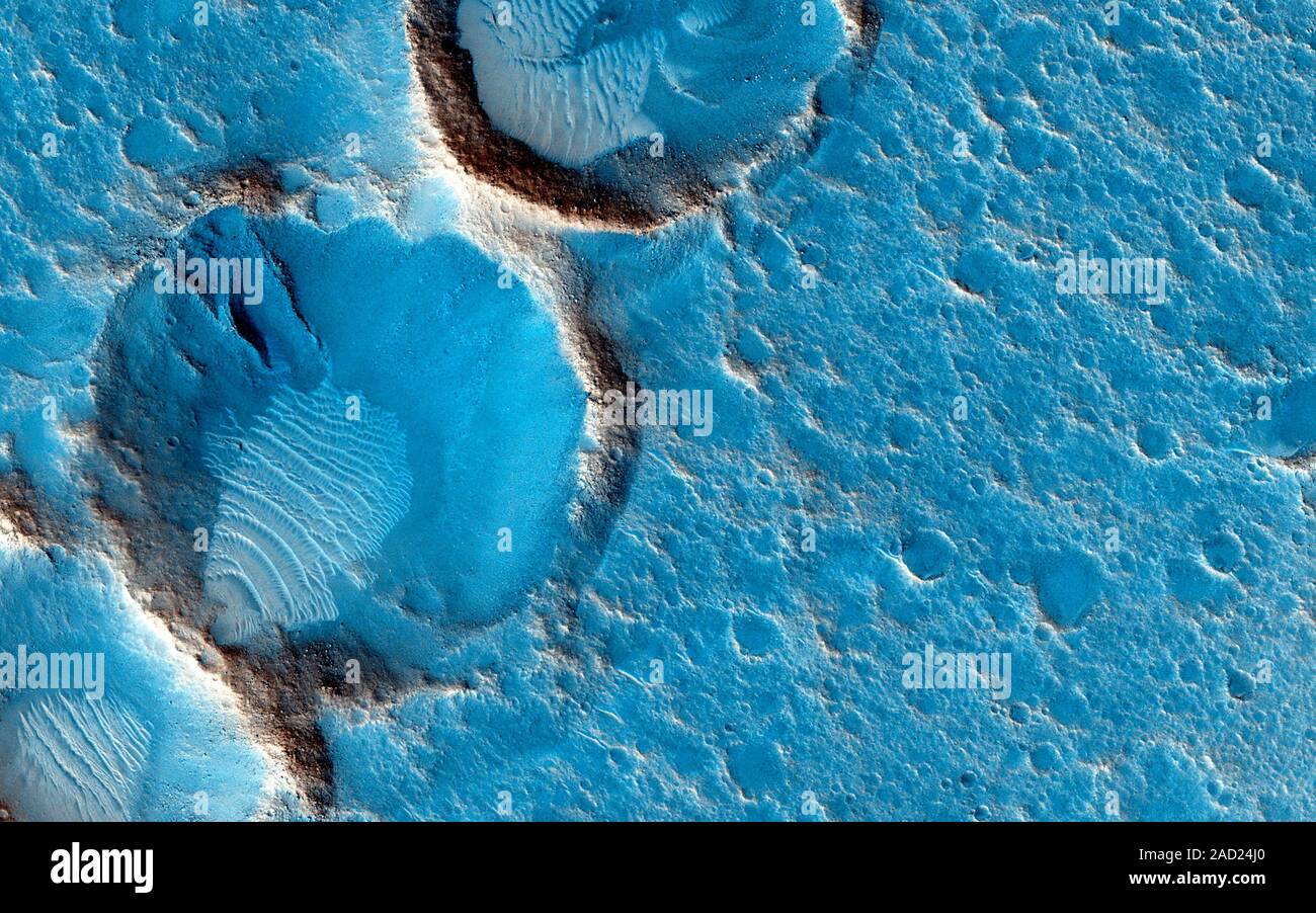 Craters on Mars. Satellite image showing wind-blown deposits inside a ...
