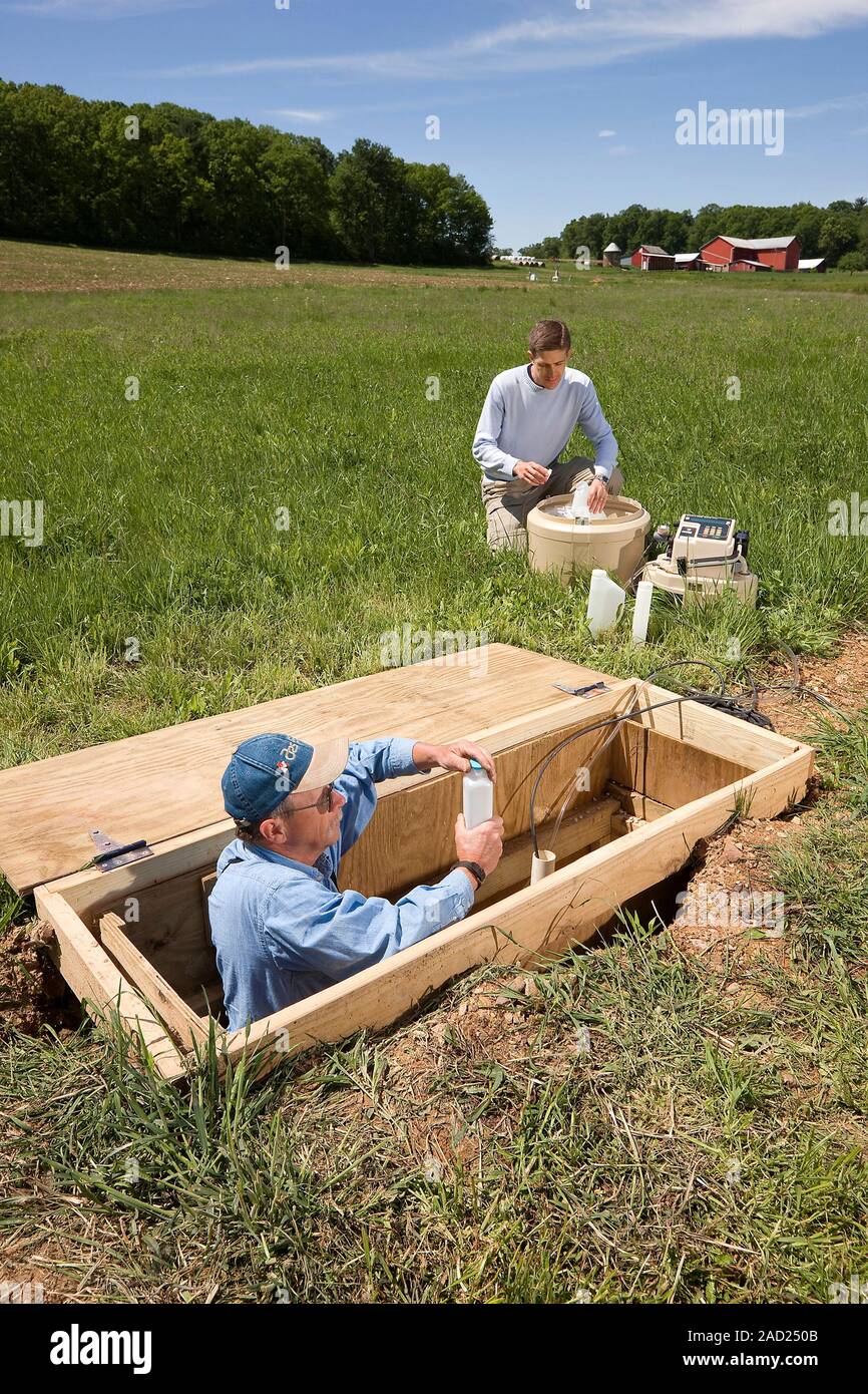 Field irrigation research. Hydrologist (right) and laboratory worker ...