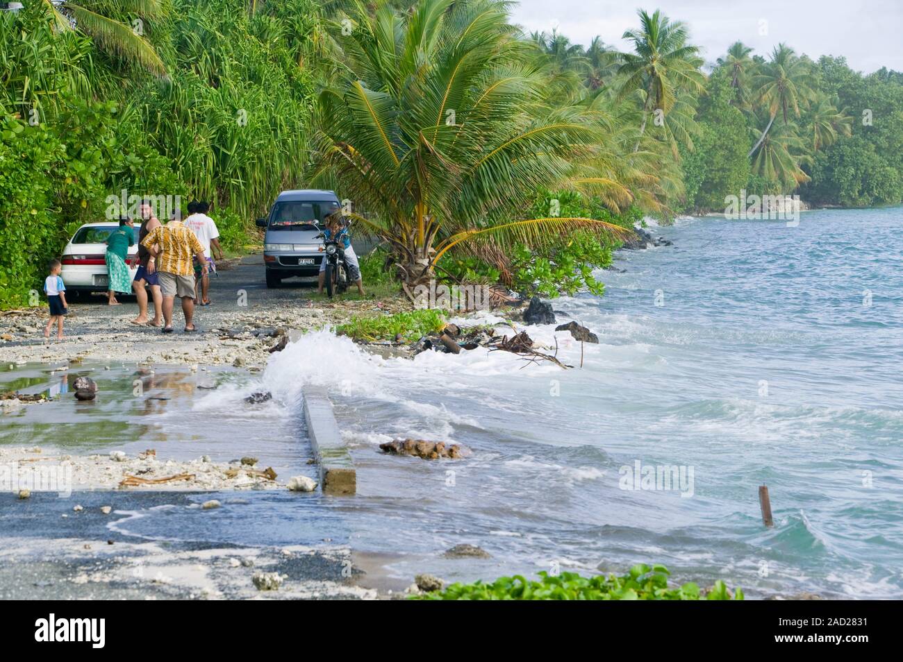 Tuvaluans watch as the high tide inundates their island home on ...