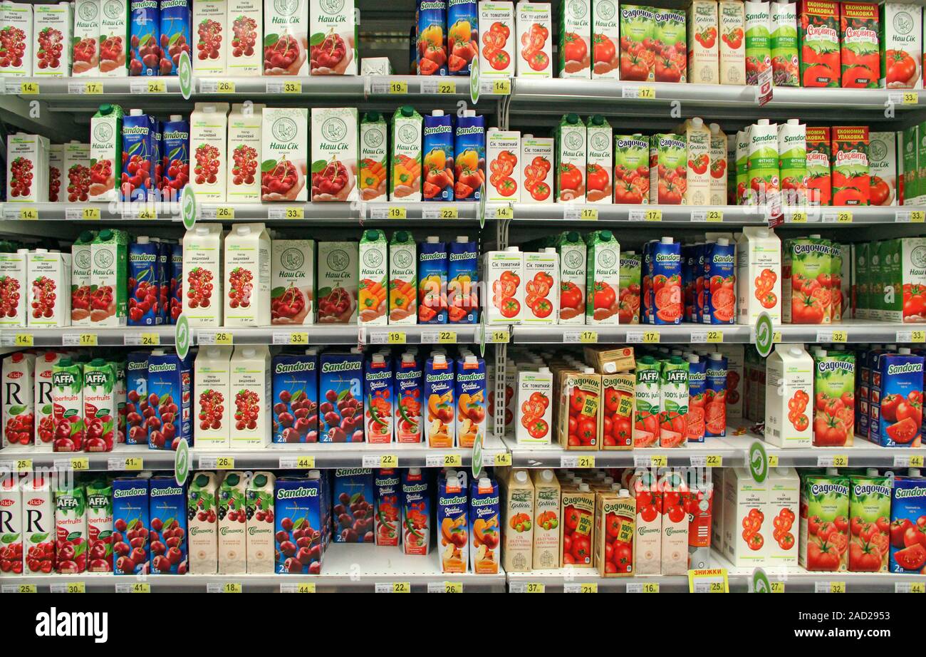 Wide range of juices on supermarket shelves. Natural juices on shelves ...