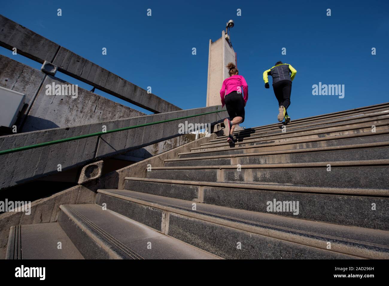 young couple jogging on steps Stock Photo - Alamy