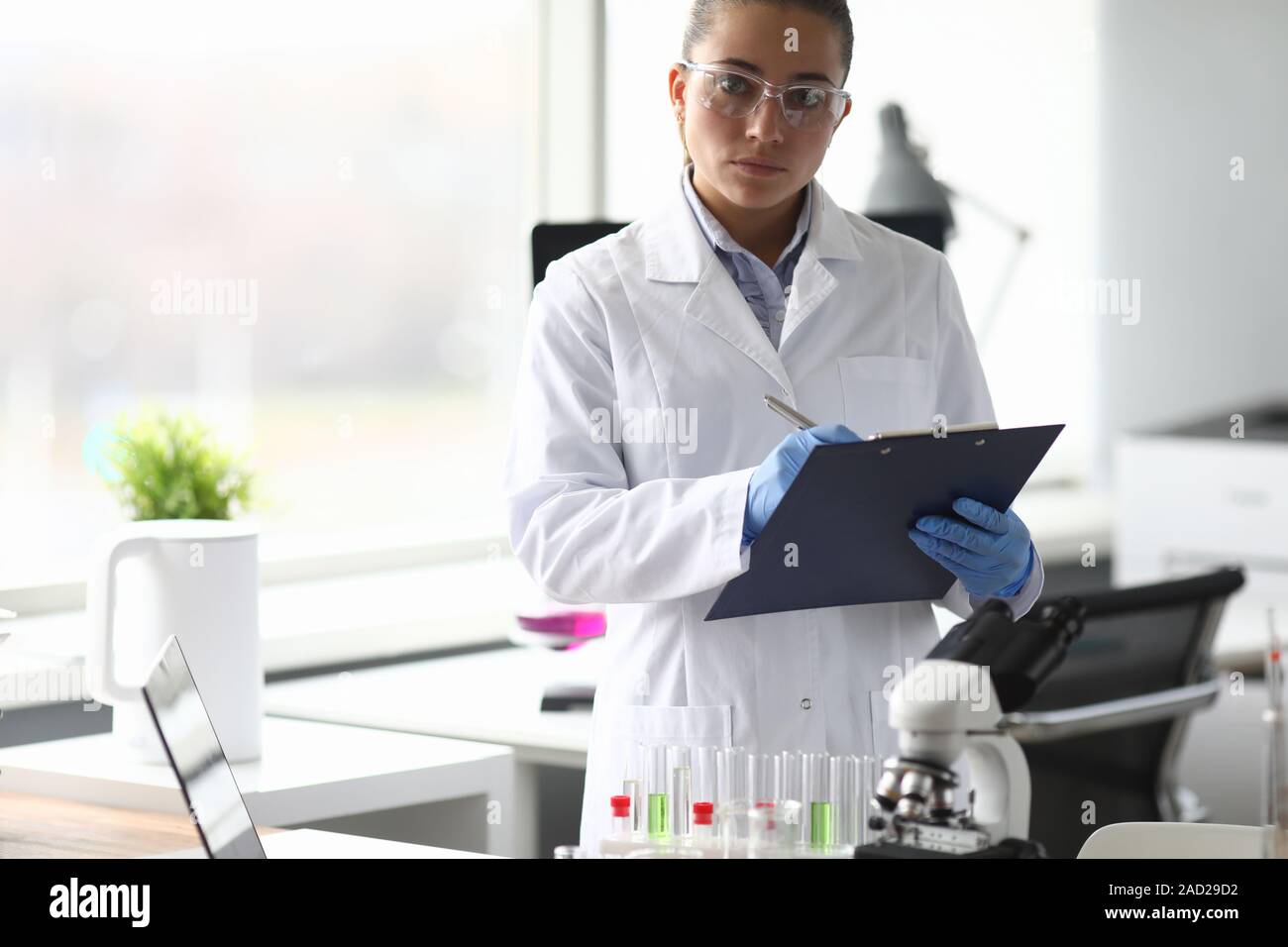 Focused researcher in light working room Stock Photo - Alamy