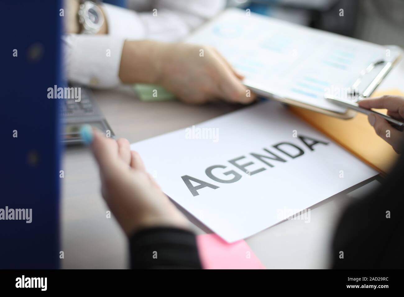 Co-workers busy on job in office Stock Photo - Alamy