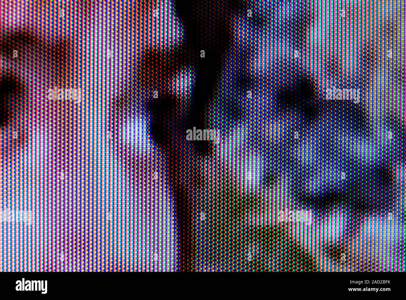 Colour television screen. Close-up of a colour flatscreen television ...