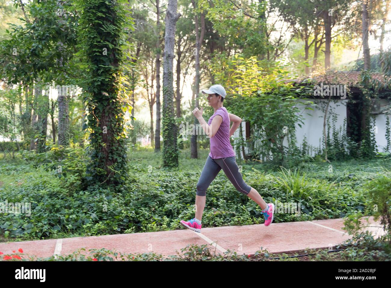 sporty woman jogging Stock Photo - Alamy