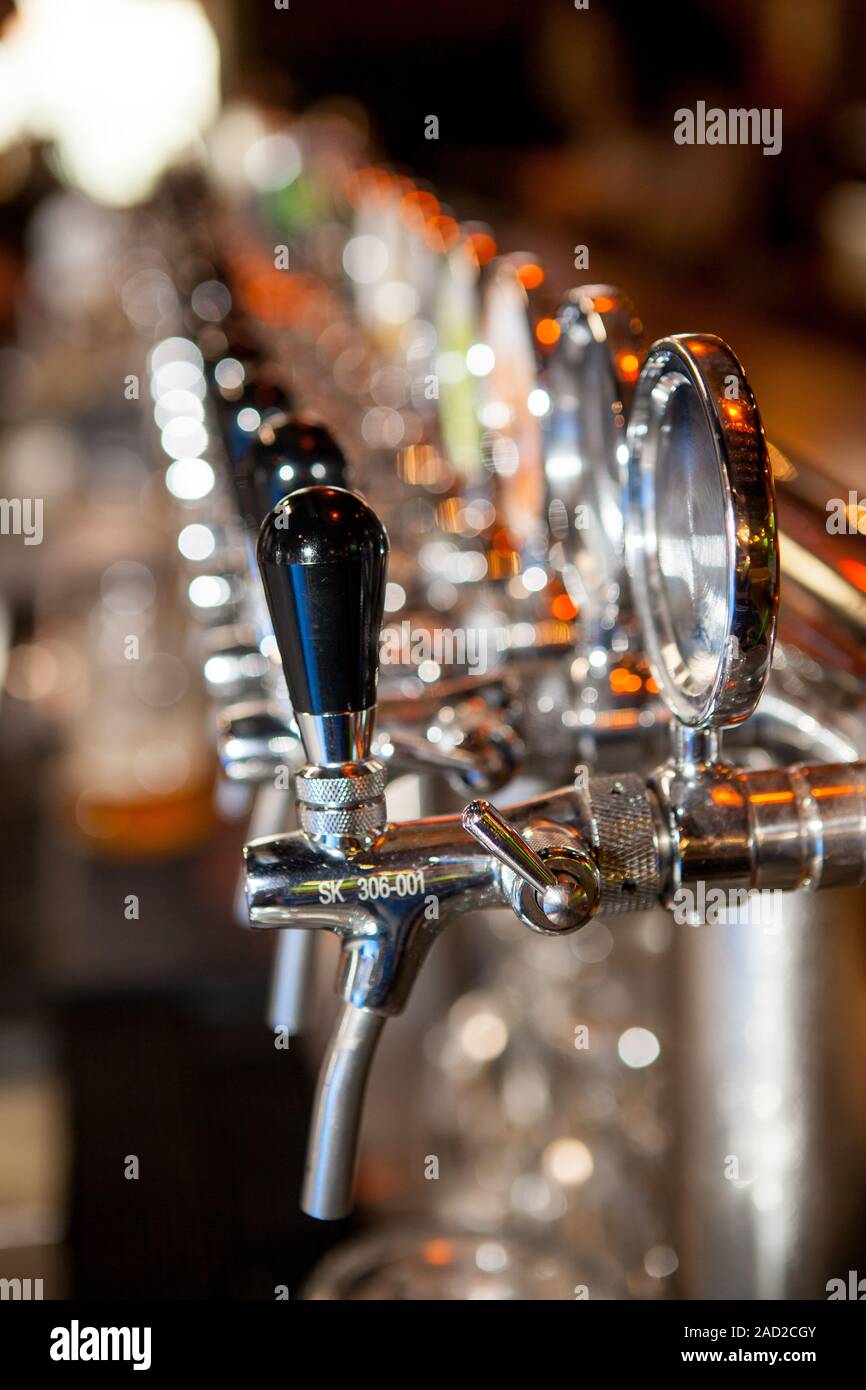 Row of Beer Taps in Bar for different types of drink. Bar interior ...