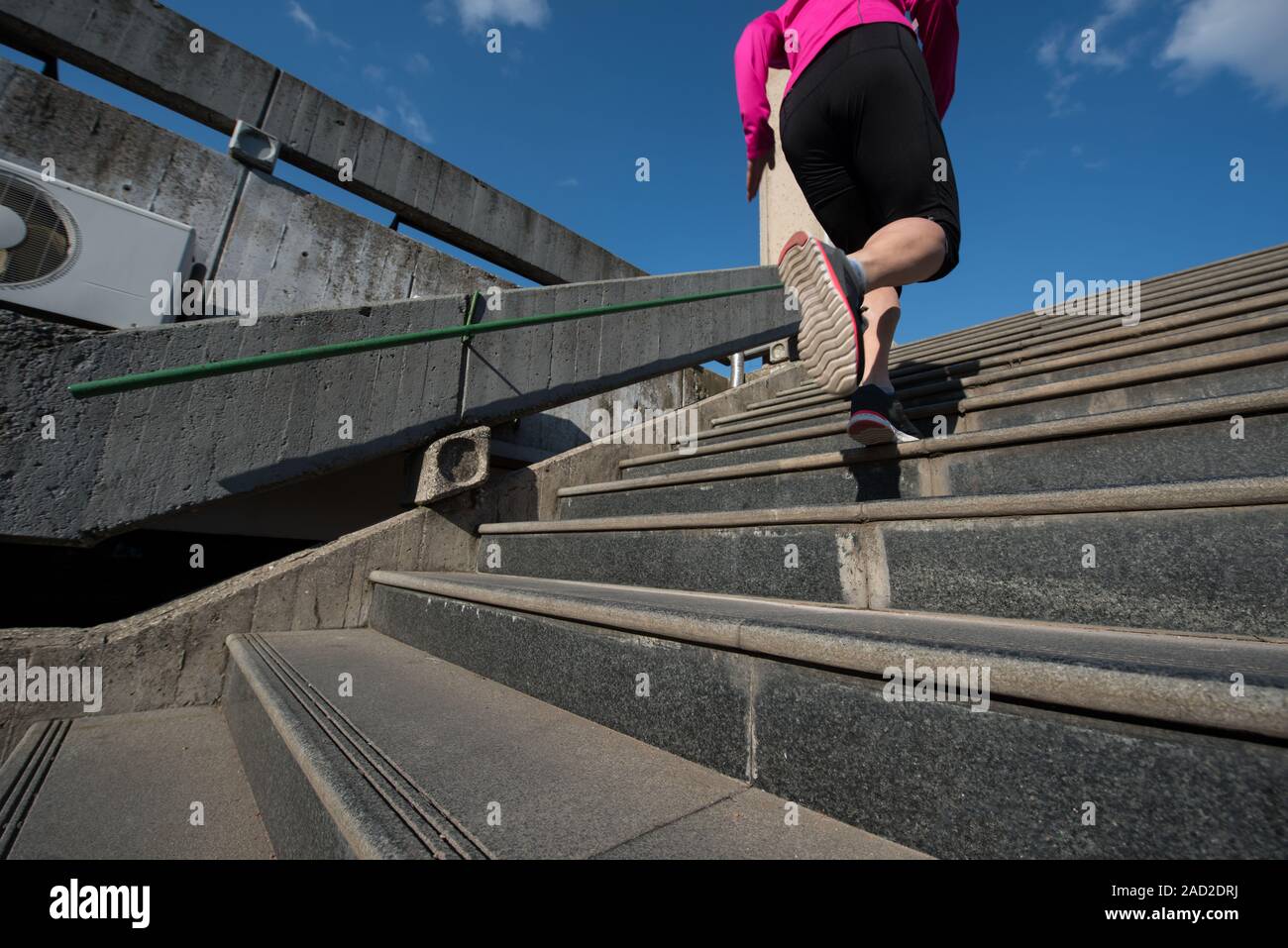 woman jogging on steps Stock Photo - Alamy