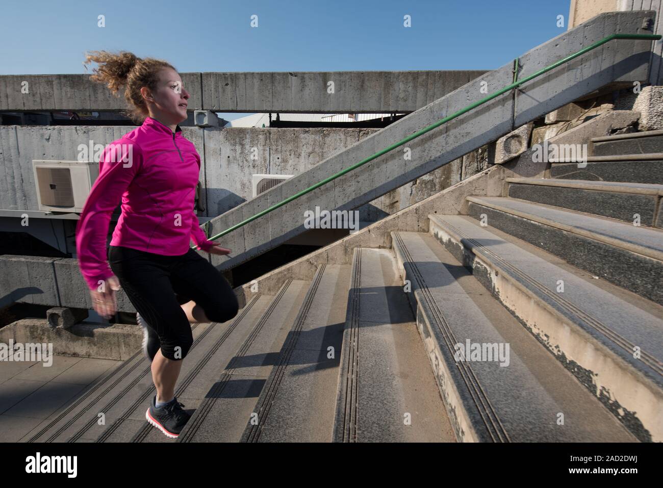 woman jogging on steps Stock Photo - Alamy