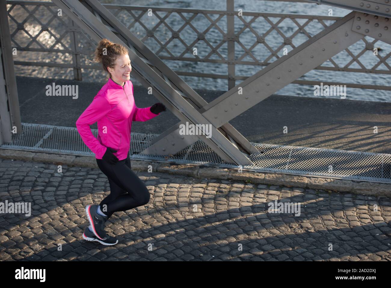 sporty woman jogging on morning Stock Photo - Alamy