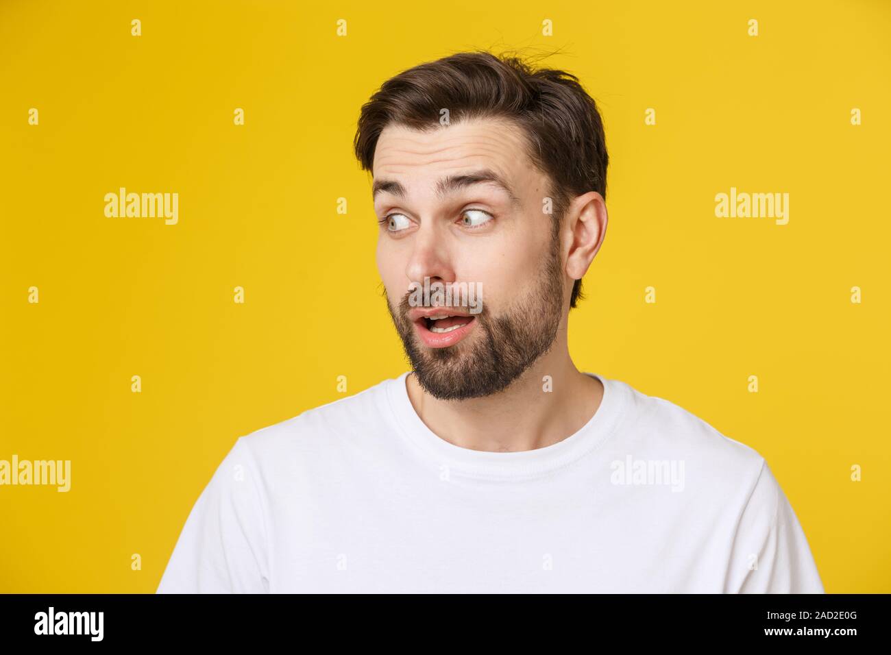 Young casual man portrait isolated on yellow background Stock Photo - Alamy