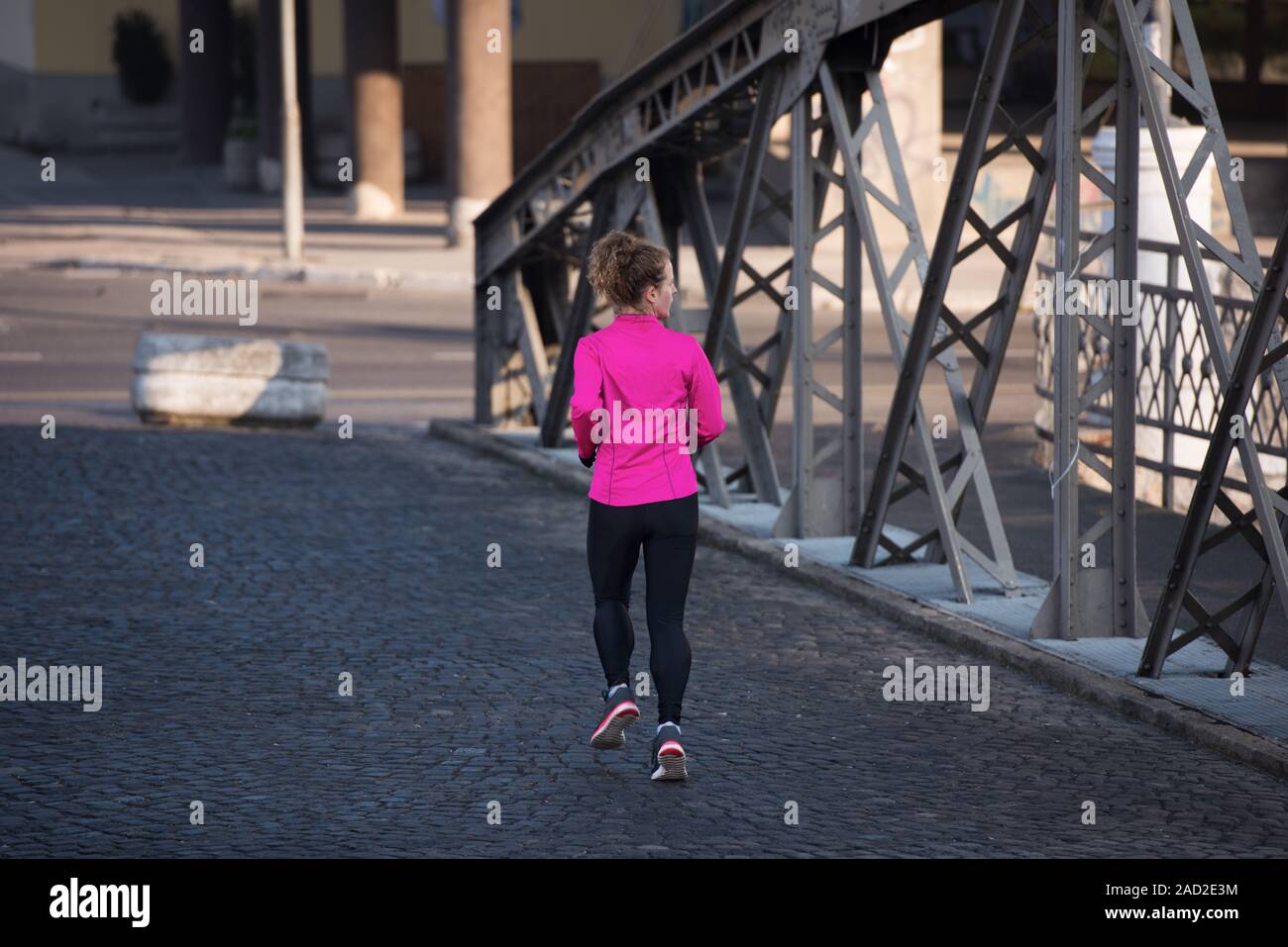 sporty woman jogging on morning Stock Photo - Alamy