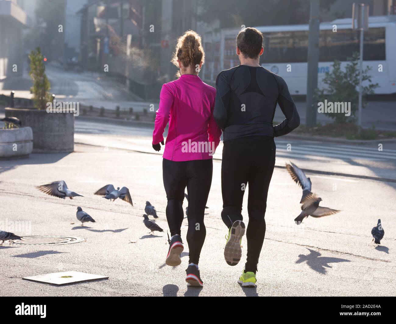young couple jogging Stock Photo - Alamy
