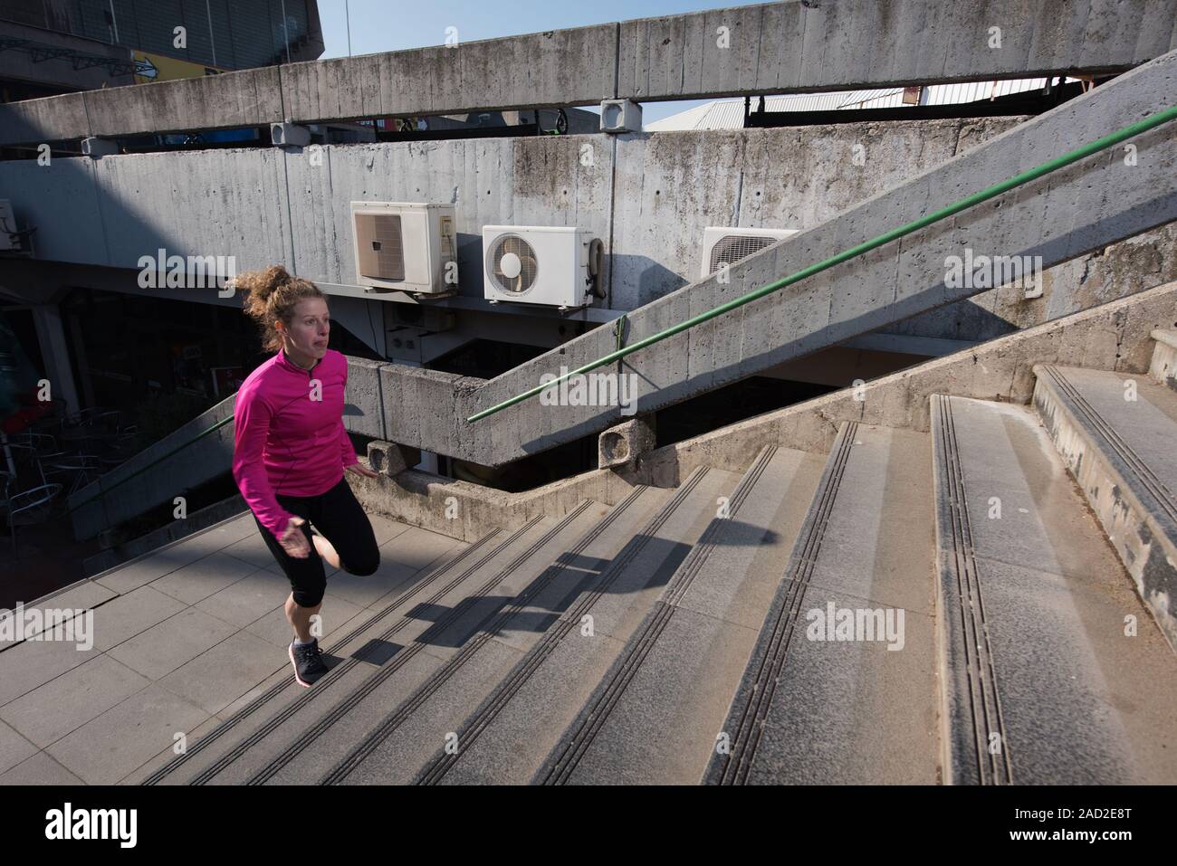 woman jogging on steps Stock Photo - Alamy