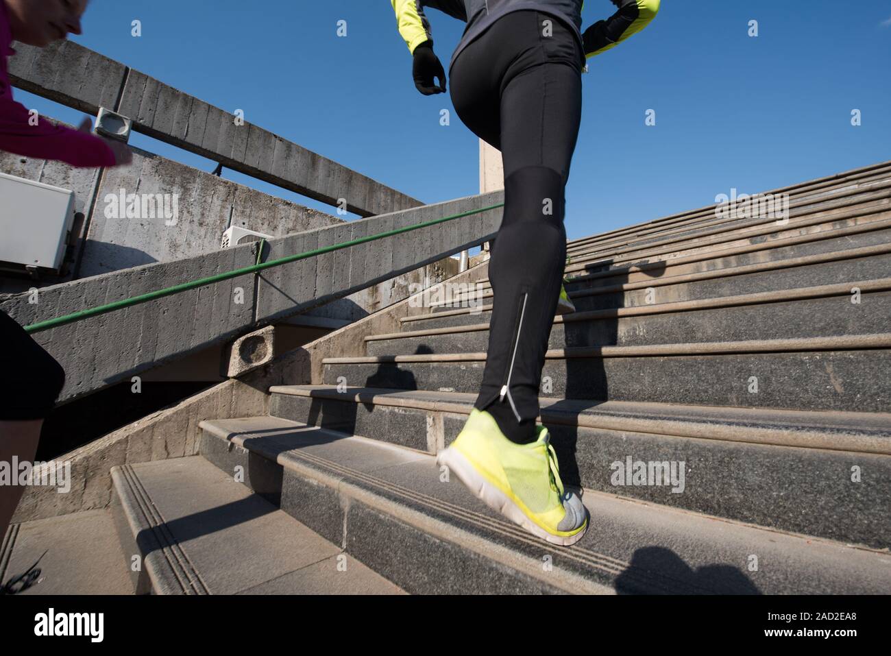 young couple jogging on steps Stock Photo - Alamy