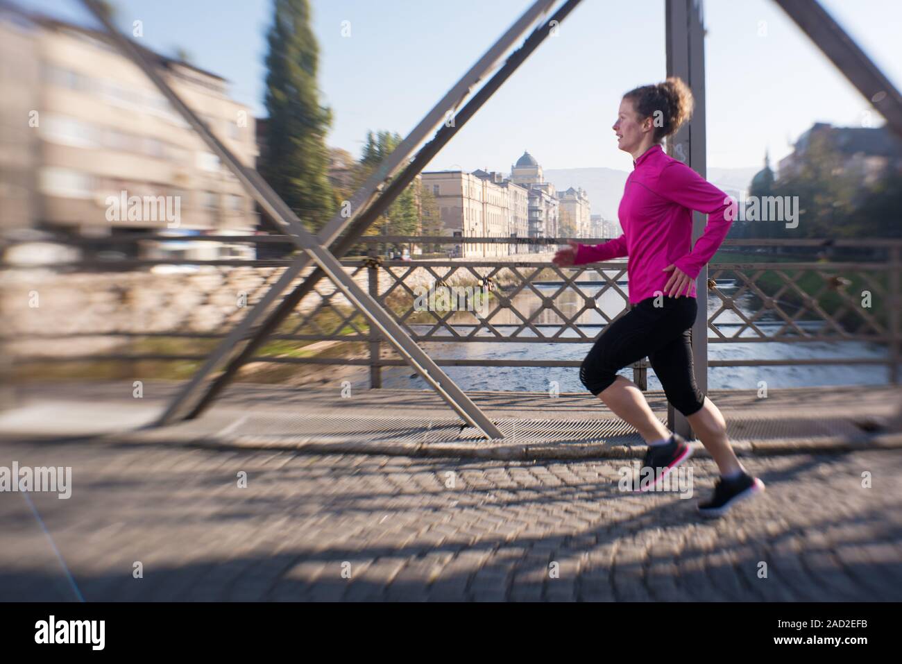 sporty woman jogging on morning Stock Photo - Alamy