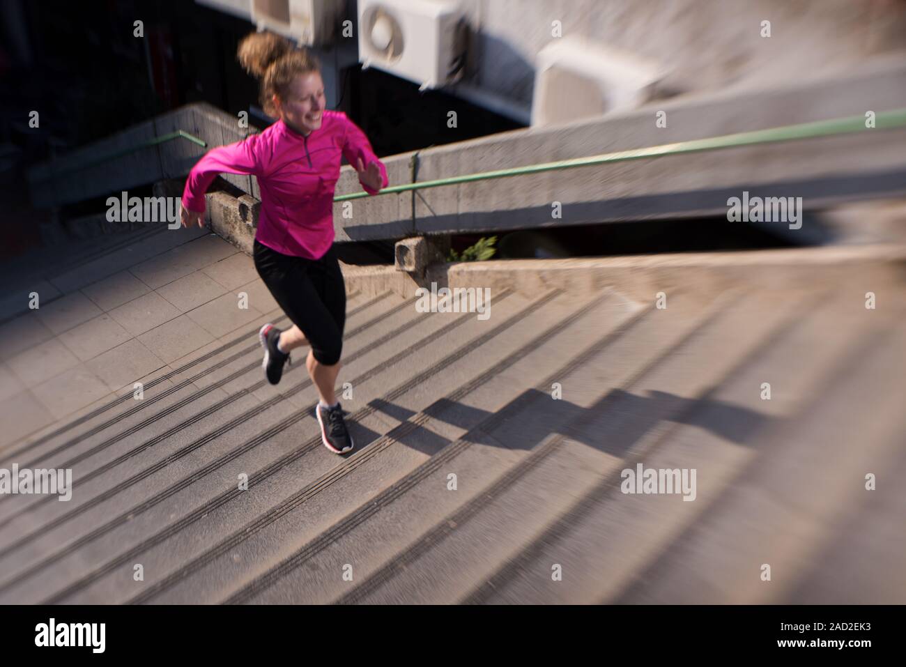 woman jogging on steps Stock Photo - Alamy