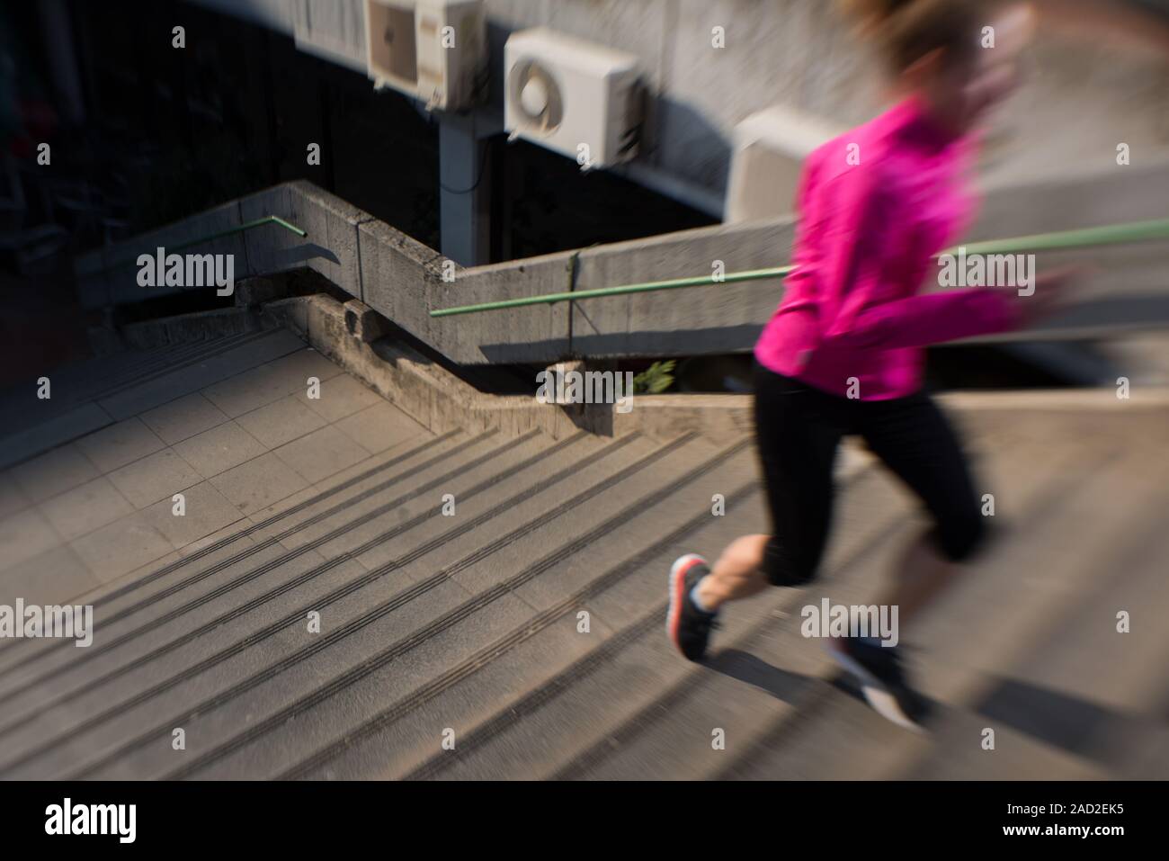woman jogging on steps Stock Photo - Alamy
