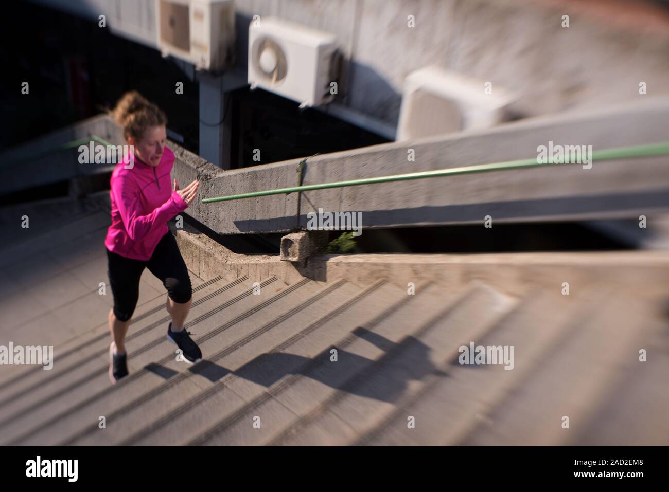woman jogging on steps Stock Photo - Alamy