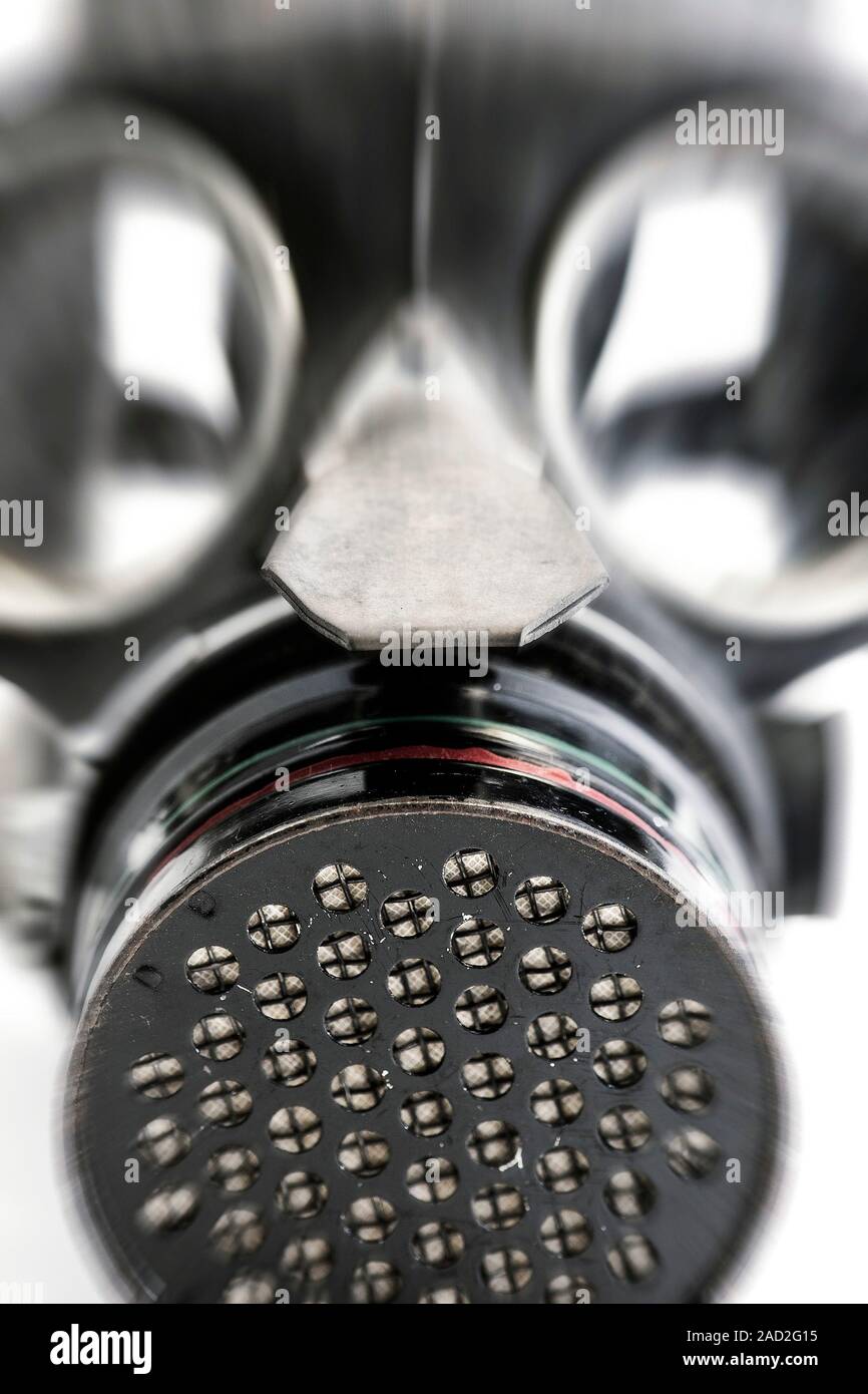 Gas mask. Close-up of a gas mask, with a filter (lower centre ...
