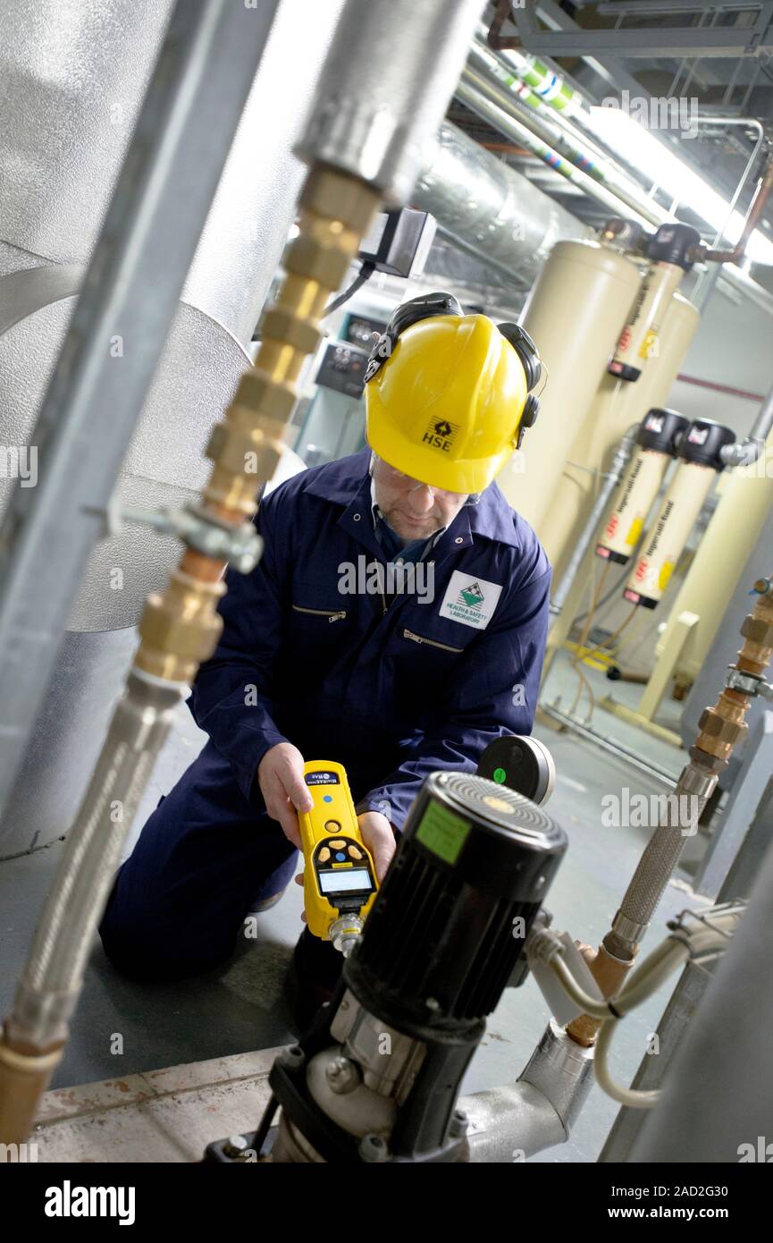 Volatile organic compounds (VOC) monitoring. Worker using a MiniRAE ...