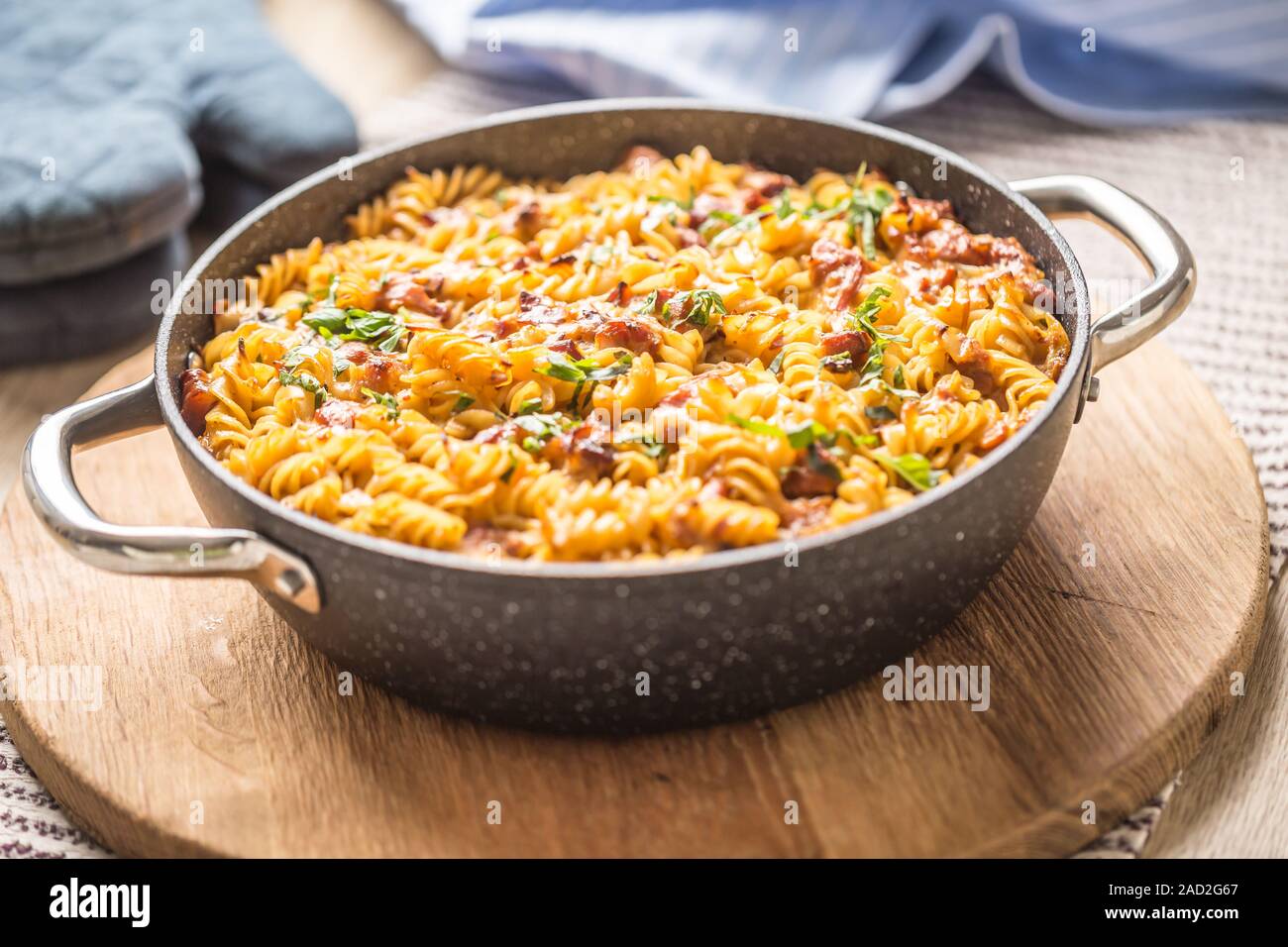 Baked pasta fusilli with smoked pork neck mozzarela cheese and othe ...