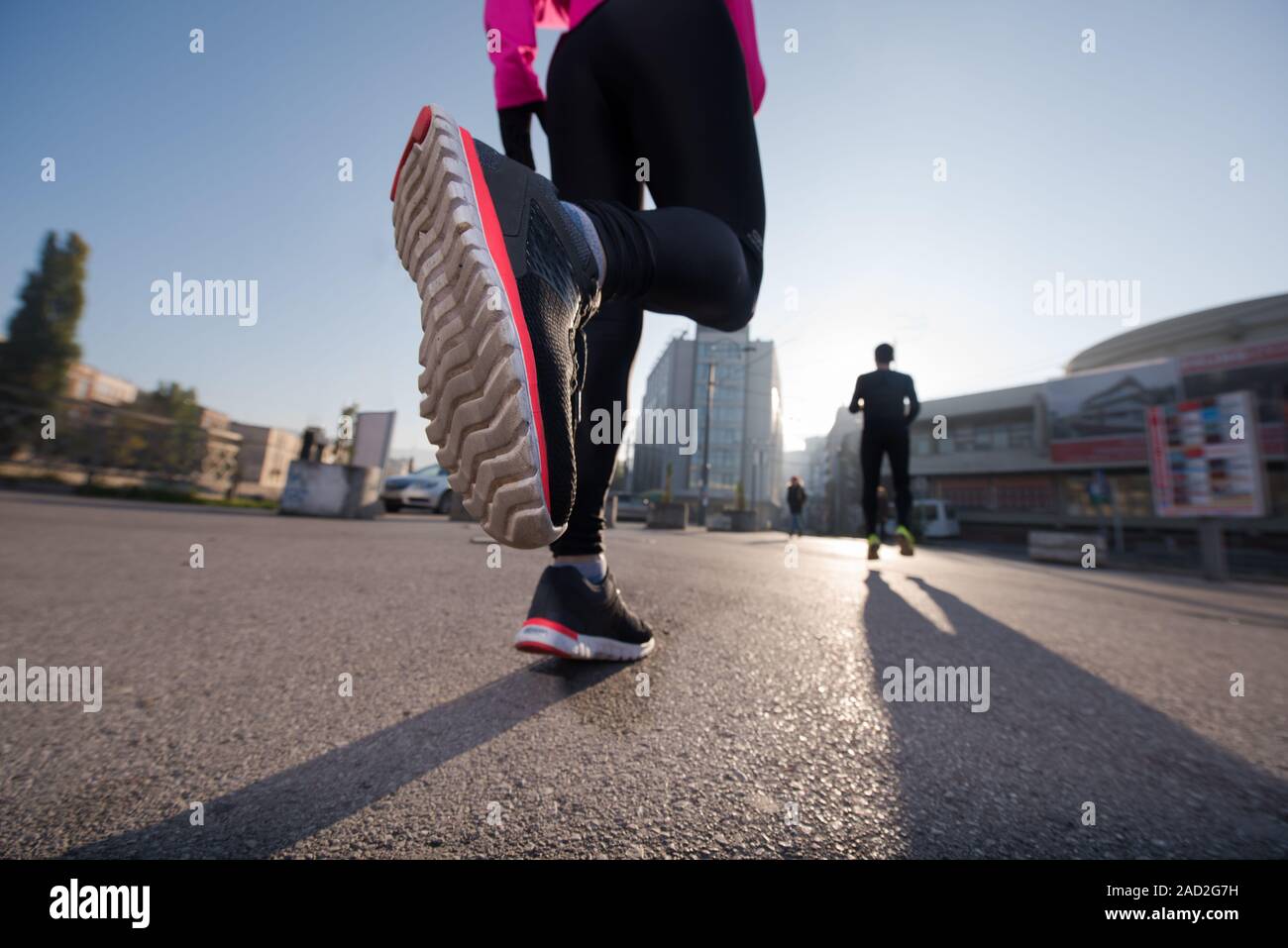 young couple jogging Stock Photo - Alamy