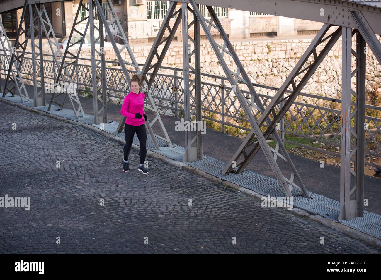 sporty woman jogging on morning Stock Photo - Alamy