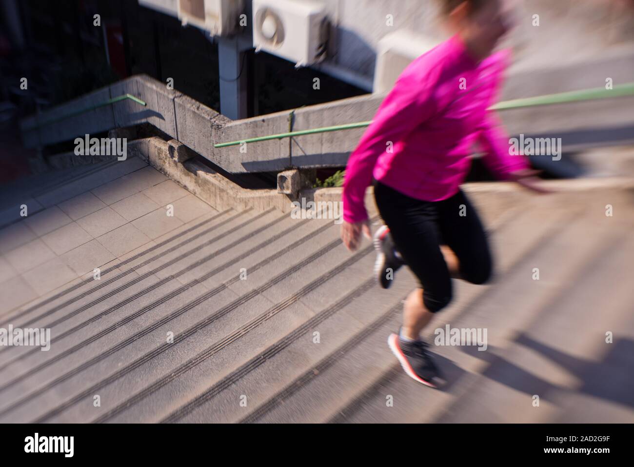 woman jogging on steps Stock Photo - Alamy
