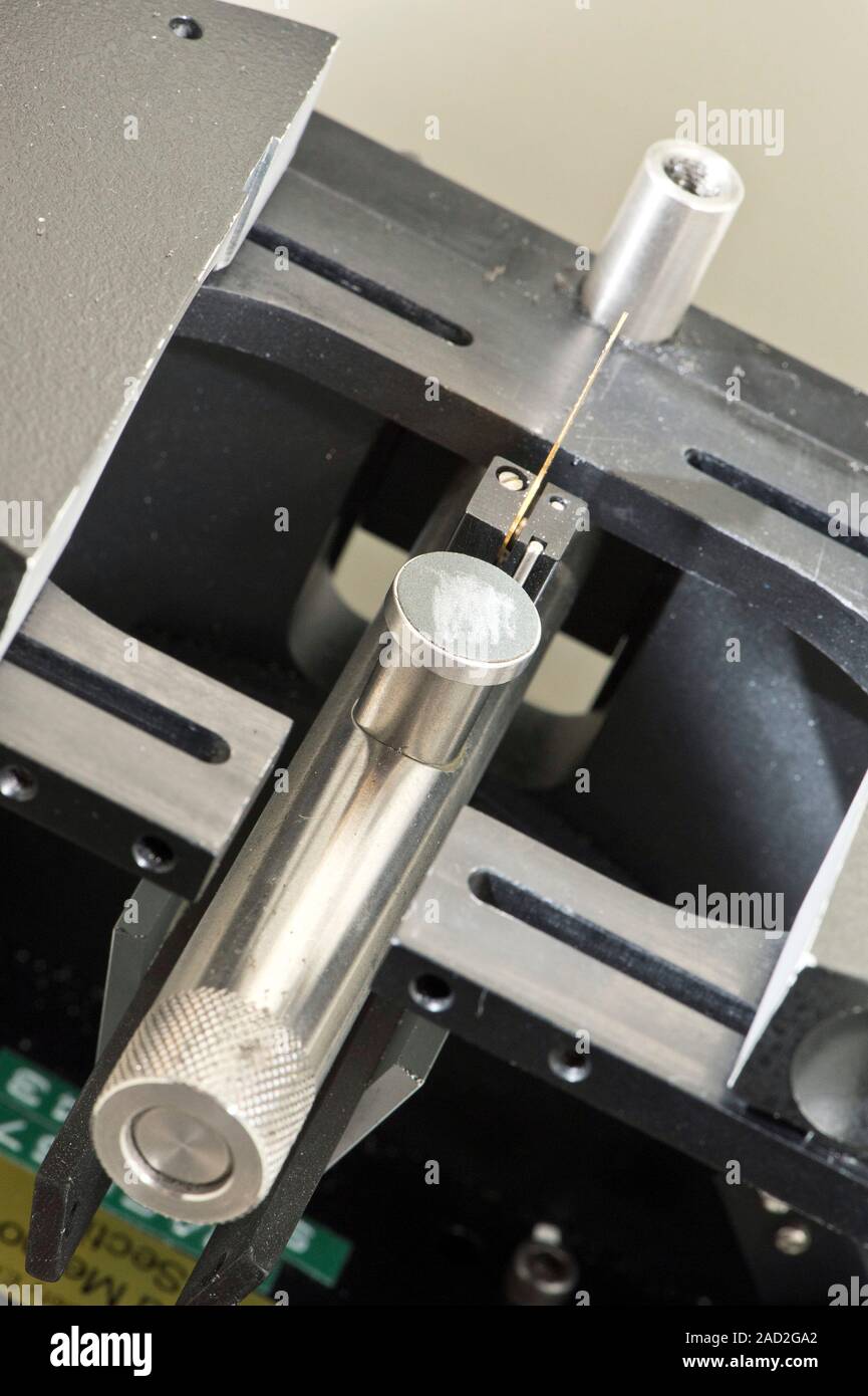 Fibre analysis equipment. Close-up of a sampling and testing device for ...