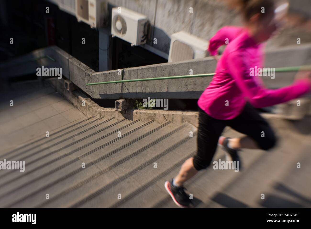 woman jogging on steps Stock Photo - Alamy